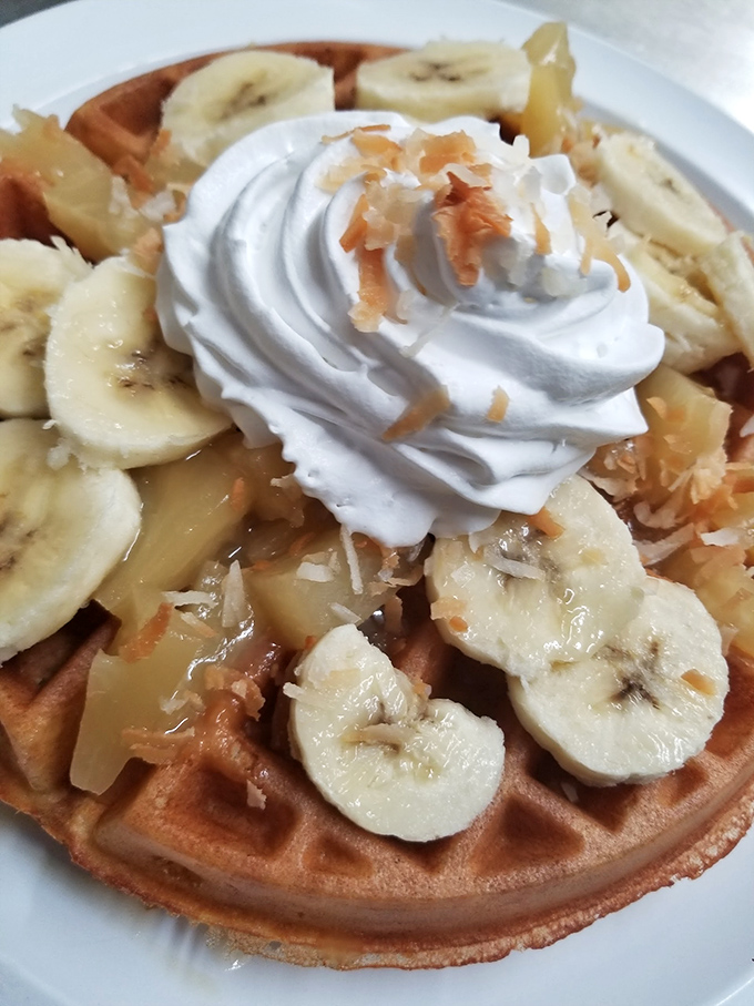 Waffle perfection crowned with bananas, whipped cream, and a drizzle of sweetness. Breakfast or dessert? At Yellow Cat Cafe, why choose when you can have both?