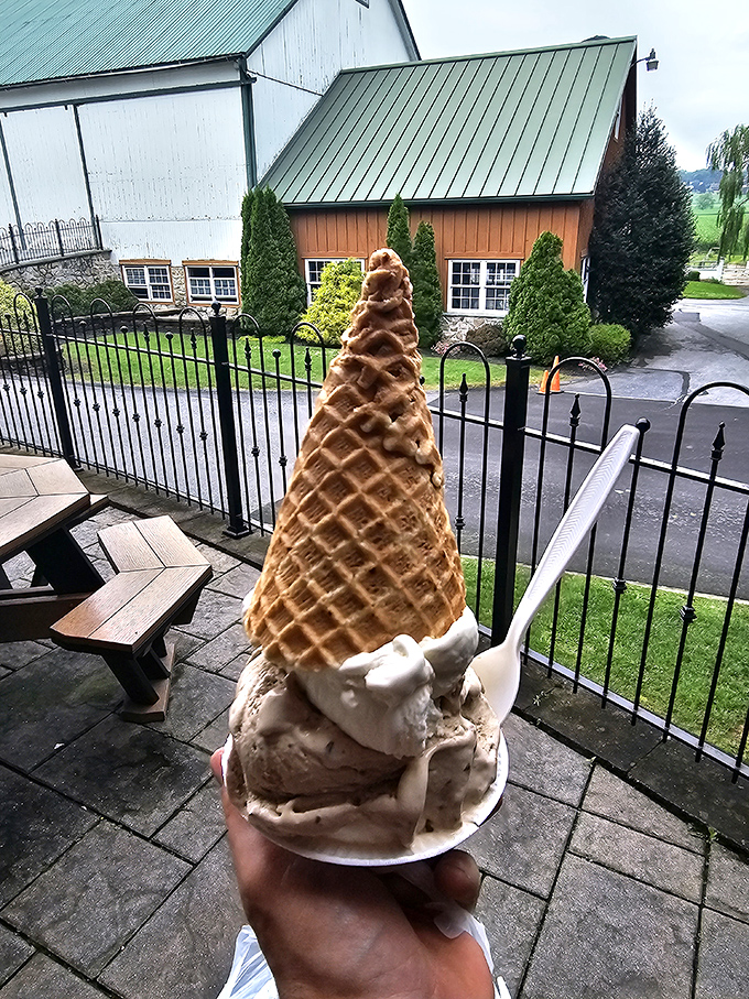 The waffle cone summit that's worth the climb. This isn't just dessert—it's an architectural achievement with a deliciously inevitable meltdown.