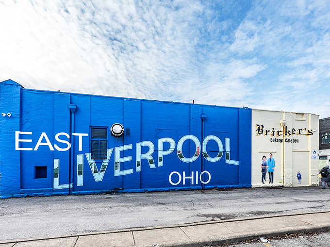 Bold blue paint declares civic pride on this eye-catching mural, proving small towns know how to make big statements about their identity.