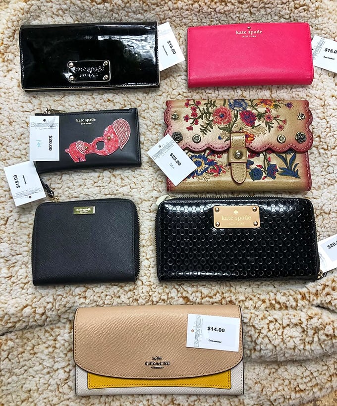 Kate Spade wallets lined up like fashionable soldiers, their price tags suggesting rebellion against retail conformity. Fashion democracy in action!