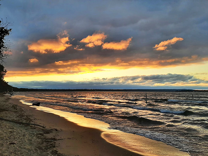 Golden hour magic turns Brimley's waves into liquid amber, proving Mother Nature remains the world's greatest light technician.
