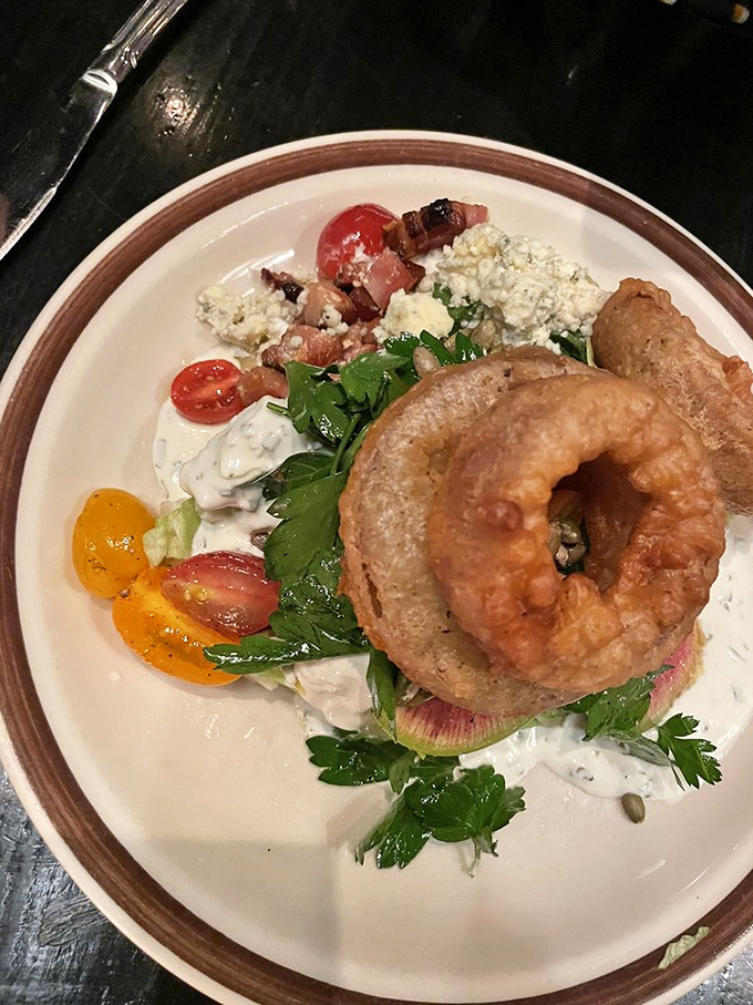 The humble wedge salad, elevated to art form&mdash;crisp lettuce, juicy tomatoes, and bacon that didn't just phone in its performance.