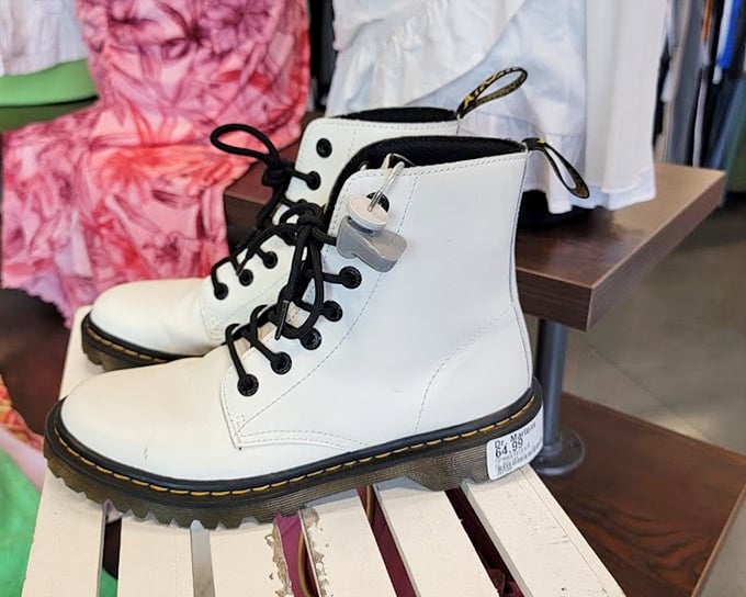 White Doc Martens that probably cost someone a week's salary, now waiting for their second dance. Fashion karma at its finest.