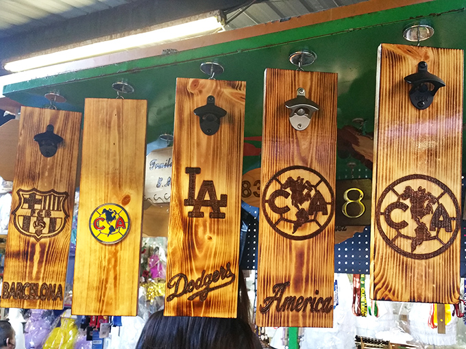 Wooden bottle openers that remember when beer came in actual bottles and nobody needed a QR code menu.