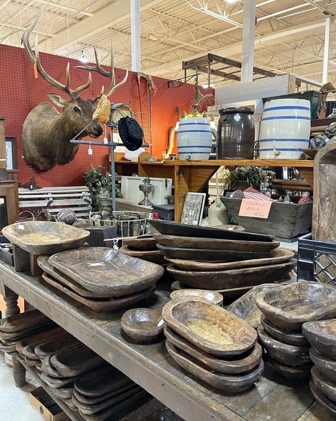 The mounted elk watches over wooden dough bowls that have kneaded more history than a Ken Burns documentary. Rustic Americana at its finest.