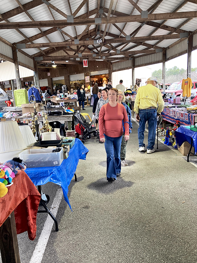 Barnyard Flea Market's outdoor section spreads across open ground where vendors display their wares under colorful tents.