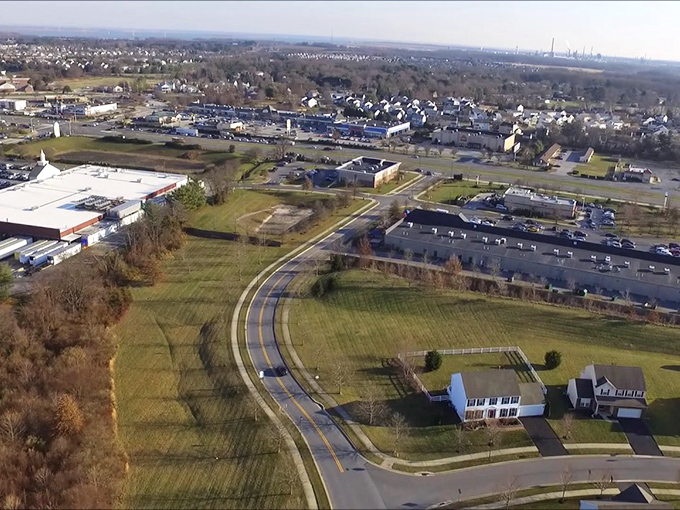 Bear's suburban landscape stretches toward horizons where affordable living meets modern convenience perfectly.