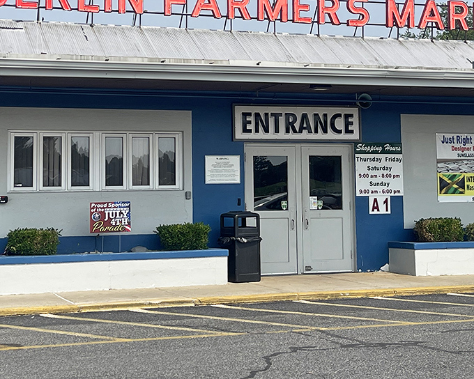 Berlin Market's blue entrance &ndash; the gateway to a world where fresh produce meets vintage vinyl in perfect harmony.