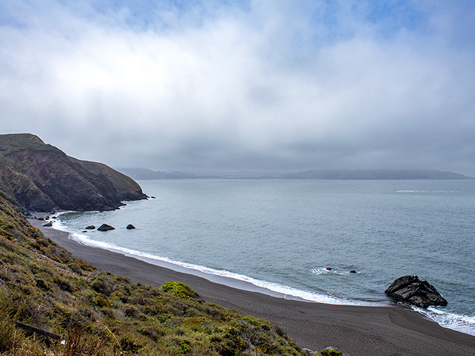 Black Sands Beach offers a dramatic palette swap from California's typical golden shores. Nature's goth phase is stunning.