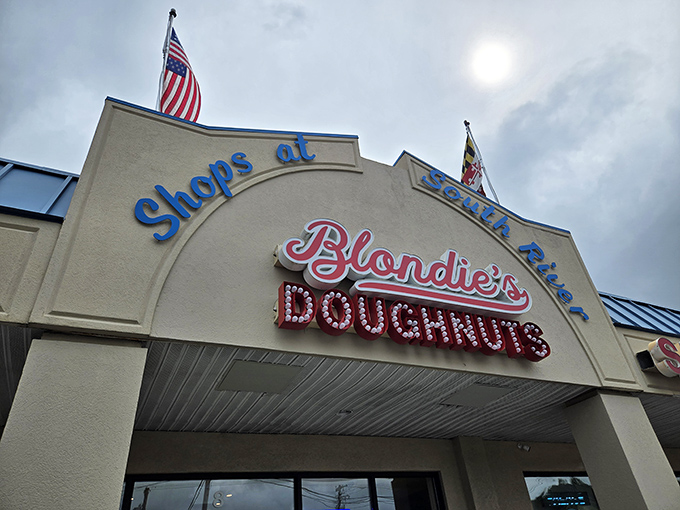 Beneath that patriotic awning lies a donut paradise where classic American indulgence gets a fresh, modern twist.