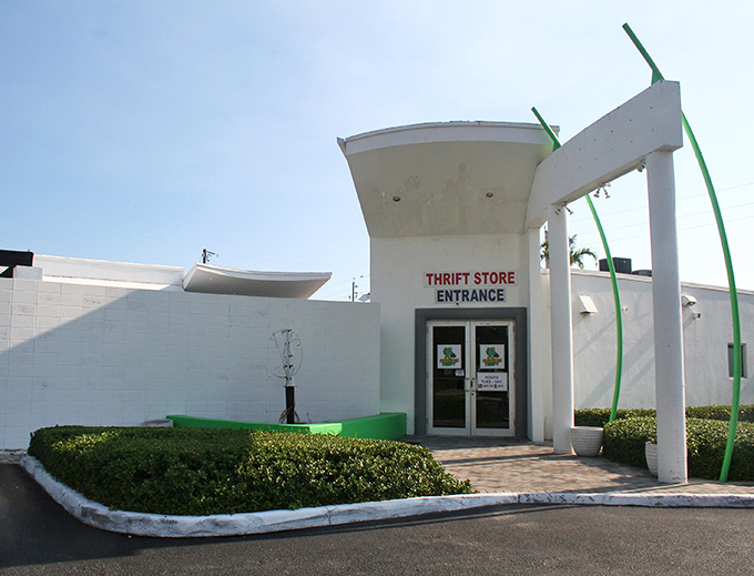 Charity Thrift Stores' modern entrance stands out with its distinctive architecture. Those green accents hint at the eco-friendly nature of thrifting!