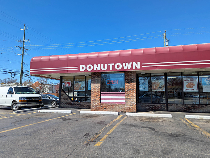 Donutown's classic red awning and brick facade scream "neighborhood institution" in the most deliciously welcoming way possible.
