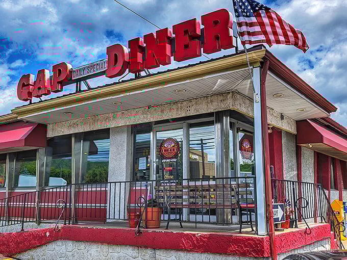 Bold red letters announce what your stomach already knows&mdash;you've found home-cooked heaven. That flag adds a patriotic touch to your pancake pilgrimage.