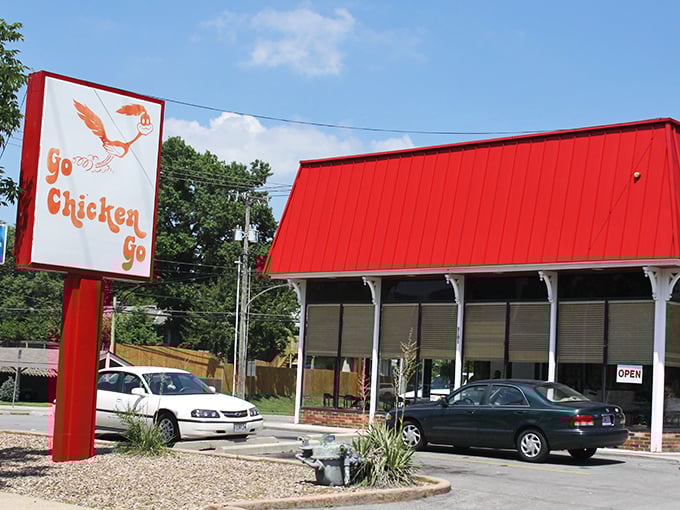 Go Chicken Go's bright red building is like a beacon for fried chicken lovers. That flying rooster sign has guided hungry folks for decades!