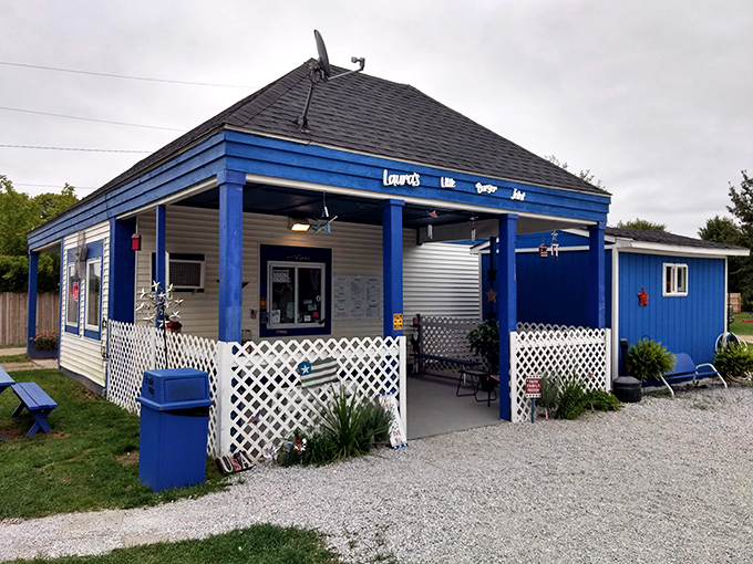 That cheerful blue paint job practically shouts "happiness lives here" to passing travelers.