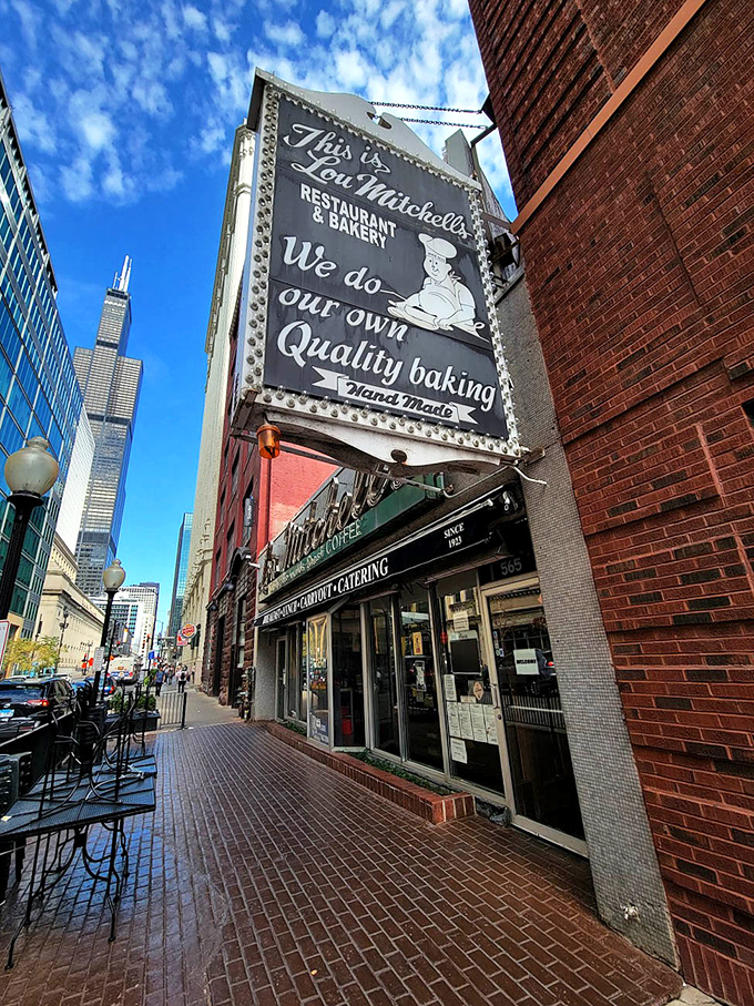 Lou Mitchell's vintage sign stands proudly against Chicago's skyline. Where Route 66 begins and diet plans end.