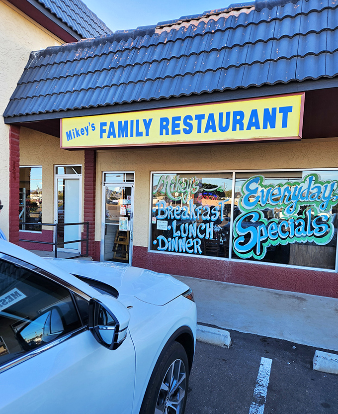 Mikey's colorful window art announces "Breakfast, Lunch, Dinner" &ndash; the holy trinity of diner delights.