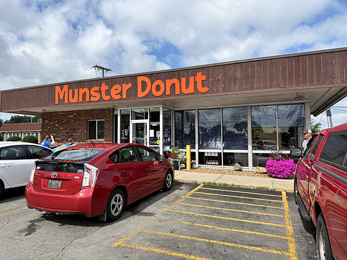 That bold orange sign has been guiding hungry morning travelers to donut nirvana for decades.