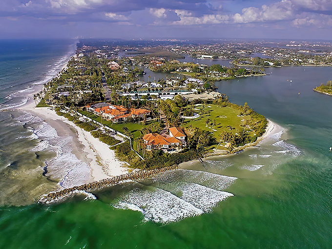 Naples' pristine pier stretches toward infinity, where Gulf breezes carry dreams of perfect beach days.