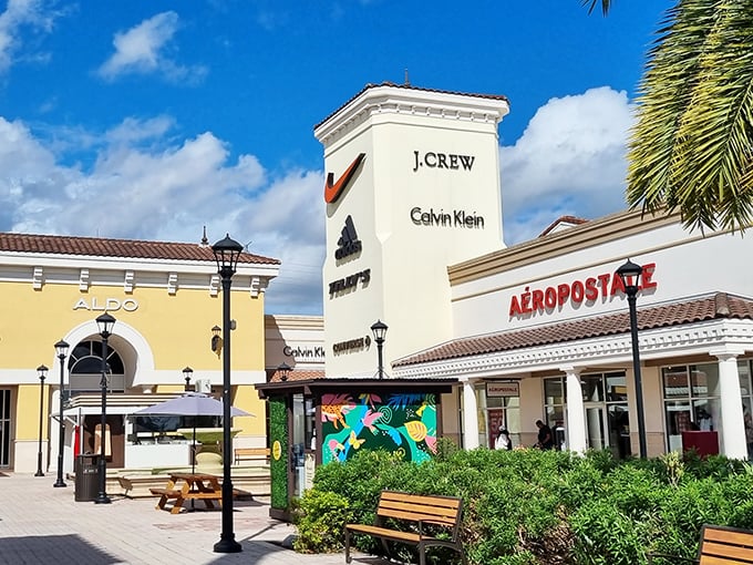 That yellow tower stands tall like a beacon calling bargain hunters home to Calvin Klein and friends. 