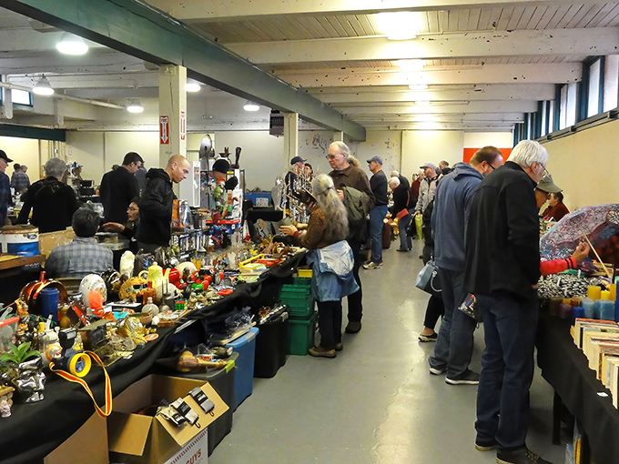 Picc-A-Dilly's indoor tables overflow with vintage finds as serious treasure hunters examine each potential discovery with care.