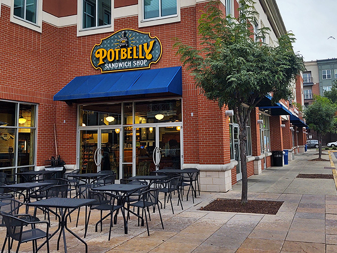 Potbelly's corner location offers a modern twist on sandwich shop charm. That blue awning is like a welcome mat for hungry visitors!
