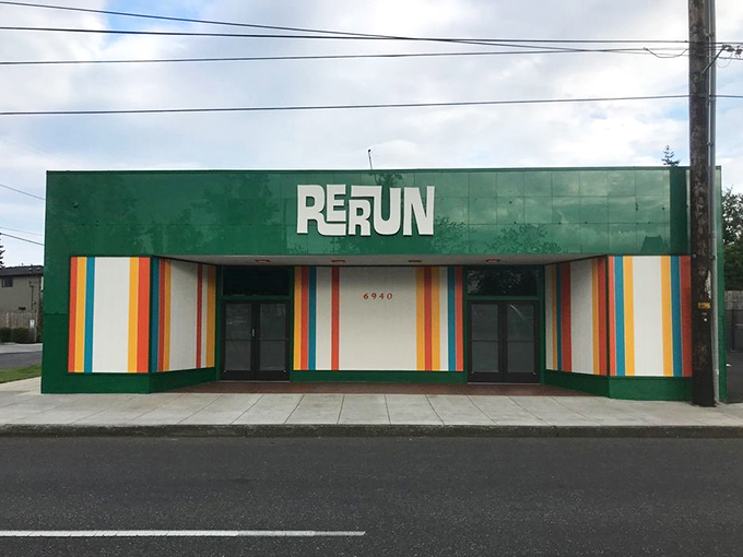 Rerun's vibrant green facade and rainbow stripes announce its playful personality. Like a Wes Anderson film set waiting for shoppers!