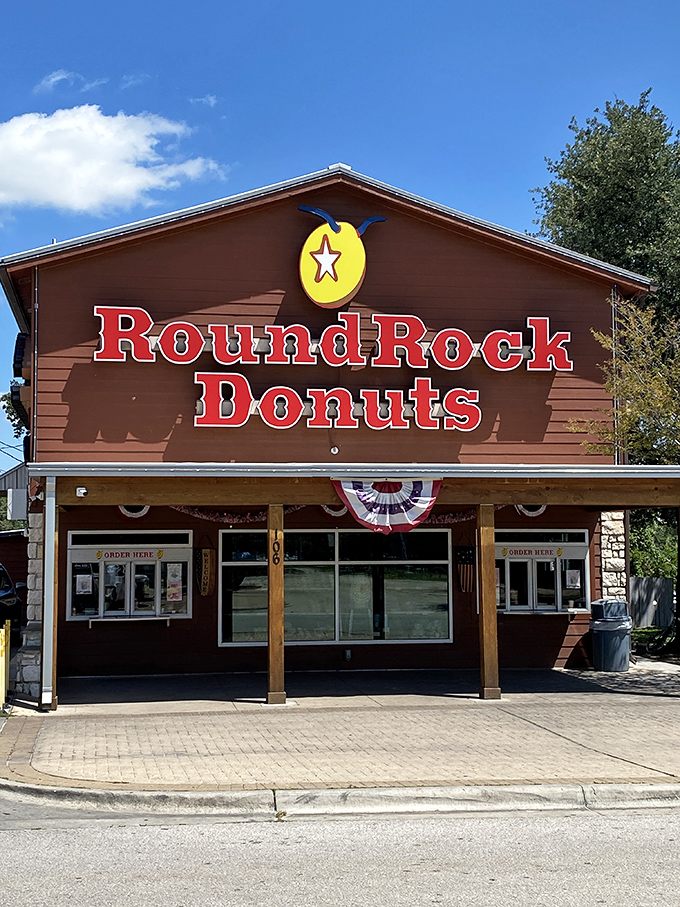 Rustic charm meets Texas tradition where orange donuts became legendary and tourists become pilgrims.