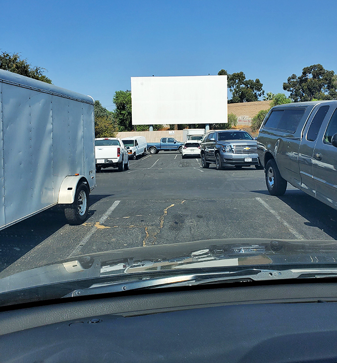 Daylight reveals Rubidoux's humble charm&mdash;this sun-baked asphalt will soon host a parade of minivans and pickup trucks seeking celluloid dreams.