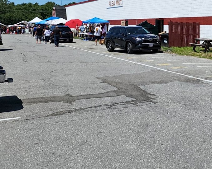 Salem Flea Market's outdoor section buzzes with activity. That sign might say "Park and Shop," but I call it "Browse and Lose Track of Time."