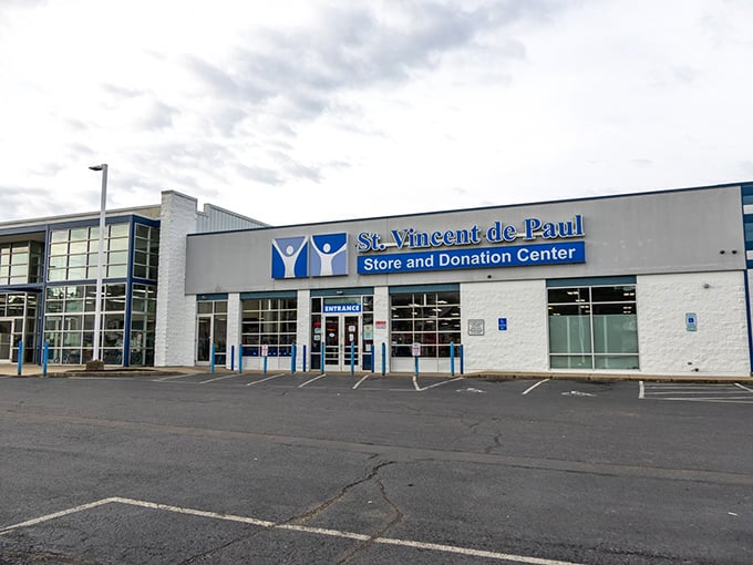 St. Vincent de Paul's modern storefront gleams in the sunlight, a cathedral of secondhand treasures waiting to be discovered.