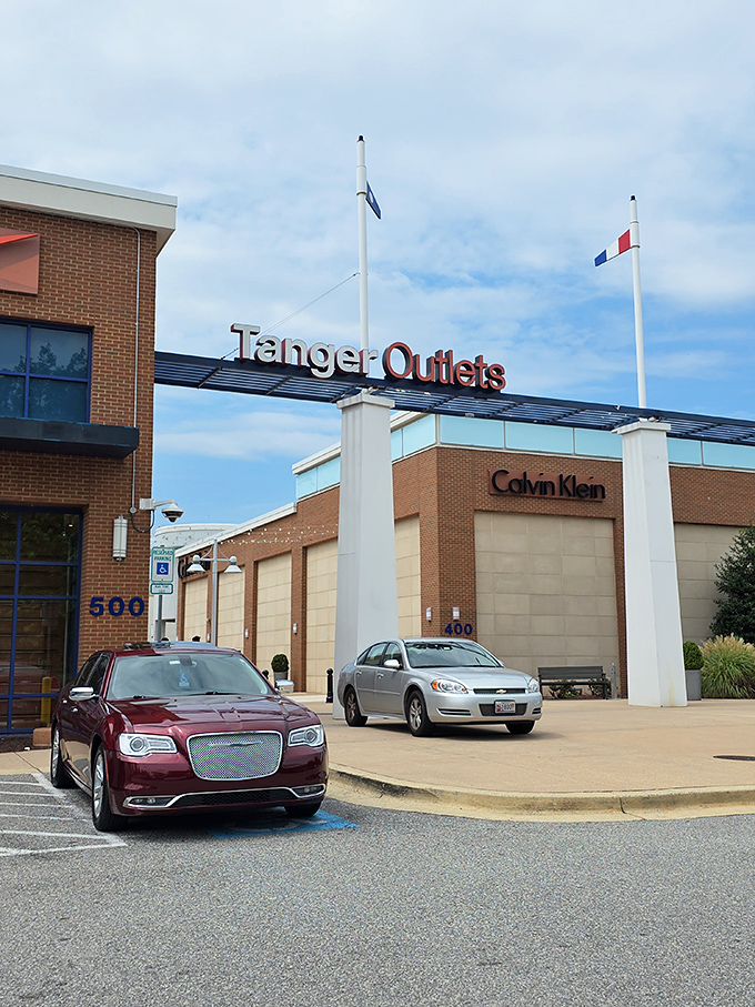 Tanger Outlets at National Harbor stands proudly with flags flying. Shopping with a side of patriotism just minutes from the nation's capital!