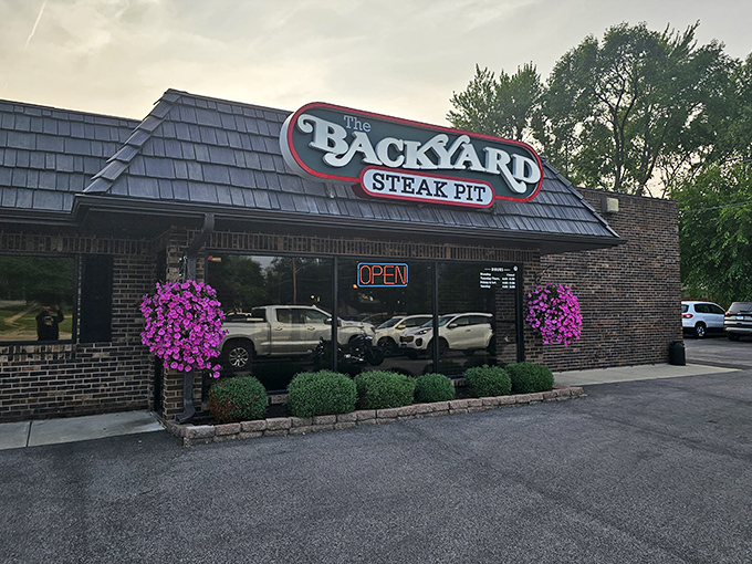 Purple flowers and "OPEN" signs - when a steakhouse cares about curb appeal, they care. 