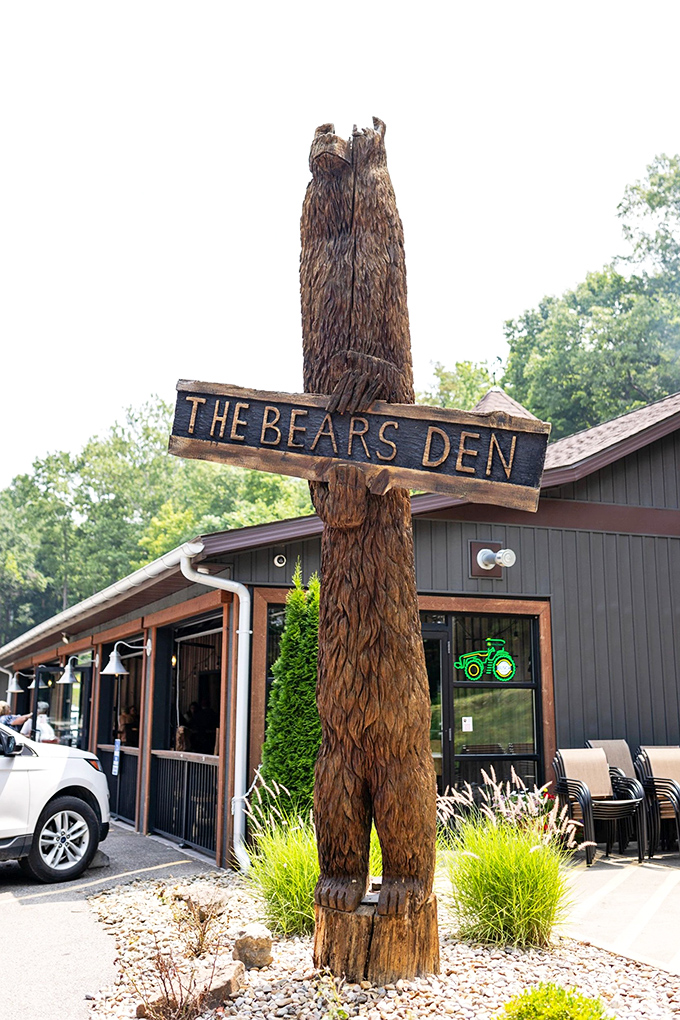 That hand-carved wooden bear stands guard over Cambridge's best-kept culinary secret - rustic charm meets excellence.