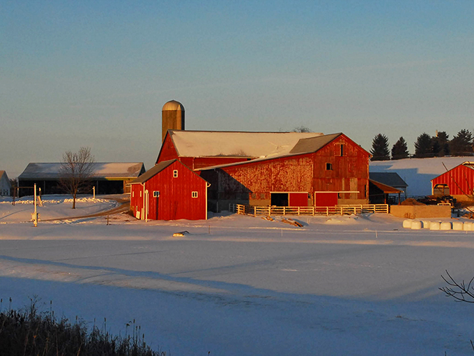 Red barns dotting snowy fields create the perfect winter postcard from Ohio.