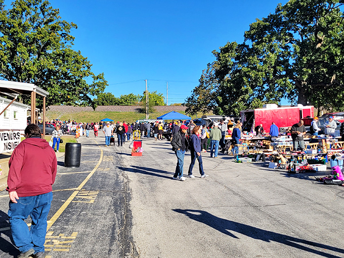 Wentzville Flea Market draws crowds under clear blue skies. A community gathering where one person's castoffs become another's treasures.