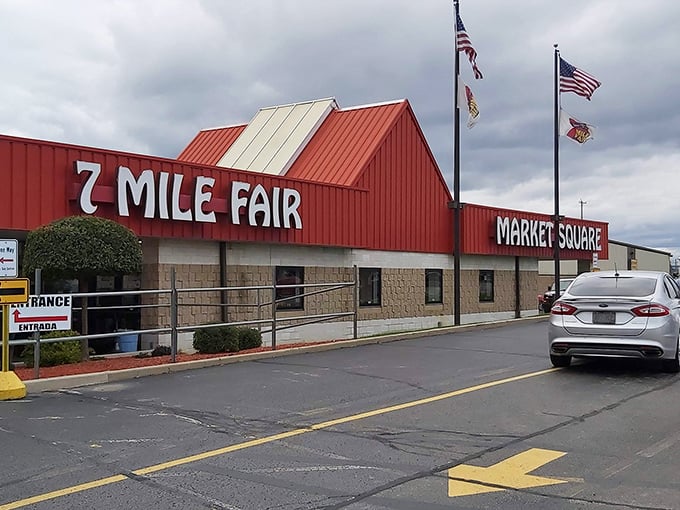Multiple flags wave proudly above this treasure hunting headquarters, welcoming all bargain seekers.