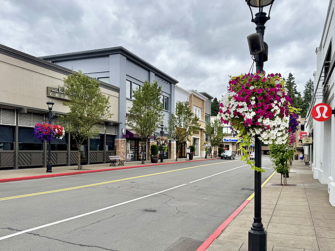 Flower baskets and charming streetscapes give Bridgeport Village the feel of a European shopping district in Oregon.