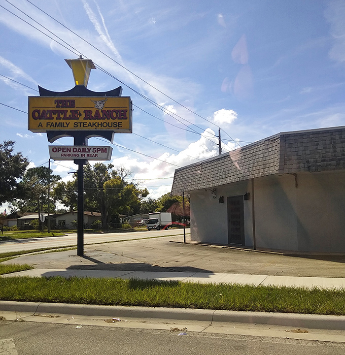 The Cattle Ranch sign stands tall like a cowboy at sunset. This no-frills exterior is the steak world's equivalent of "it's what's inside that counts."