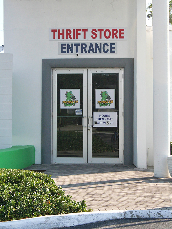 A closer look at the entrance reveals clear hours and branding. Monster Thrift sounds like a place where bargains are monstrously good!