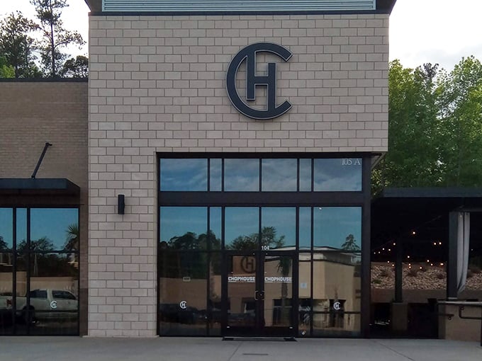 That sophisticated exterior hints at the elevated dining experience waiting inside this Chapin steakhouse gem.