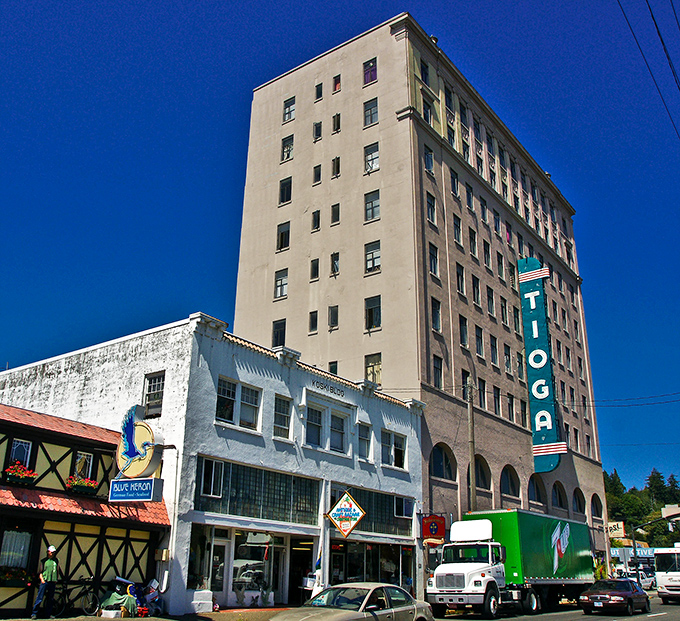 Coos Bay's historic Tioga Hotel towers over downtown, a reminder of the city's rich maritime history and enduring coastal character.