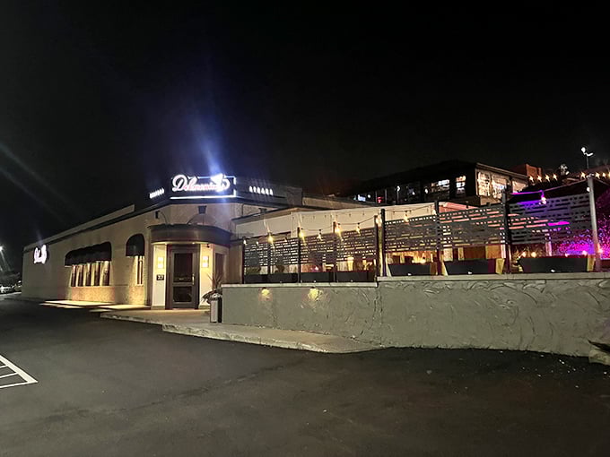 Evening lights illuminate a steakhouse that transforms ordinary nights into memorable dining experiences.