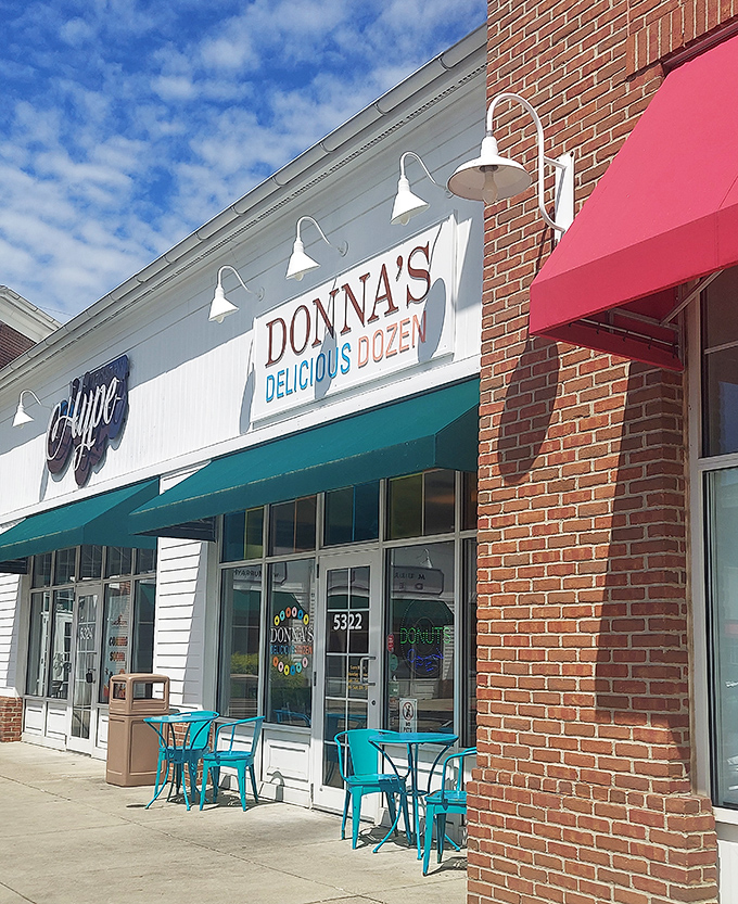 Those turquoise chairs are practically begging you to sit down and savor every bite of donut perfection.