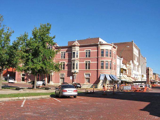 The warm red brick buildings of Fort Scott's downtown square frame a community where affordability never went out of style.