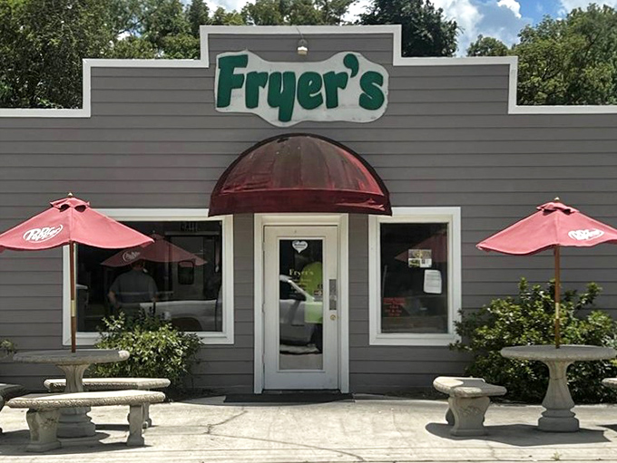 That red awning beckons travelers like a beacon for perfectly crispy, golden fried chicken.