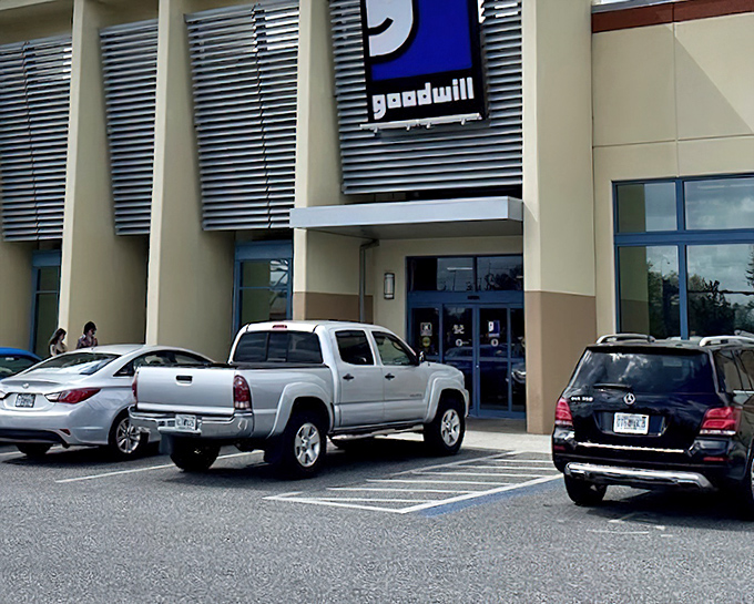 Goodwill's spacious parking lot hints at the treasure-filled warehouse within. Adventure awaits just beyond those doors!