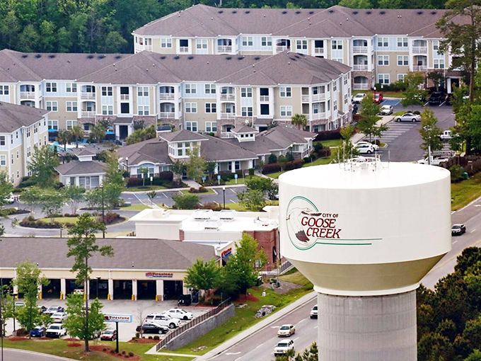 The iconic Goose Creek water tower stands sentinel over residential developments. A growing community with small-town prices.