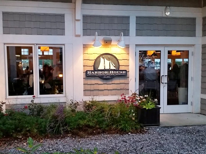 The warm glow through those windows suggests cozy conversations over perfectly prepared plates of lake-fresh goodness.