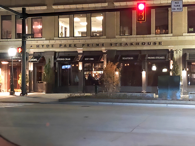 Evening lights illuminate where serious steak lovers gather for perfectly aged beef and good conversation.